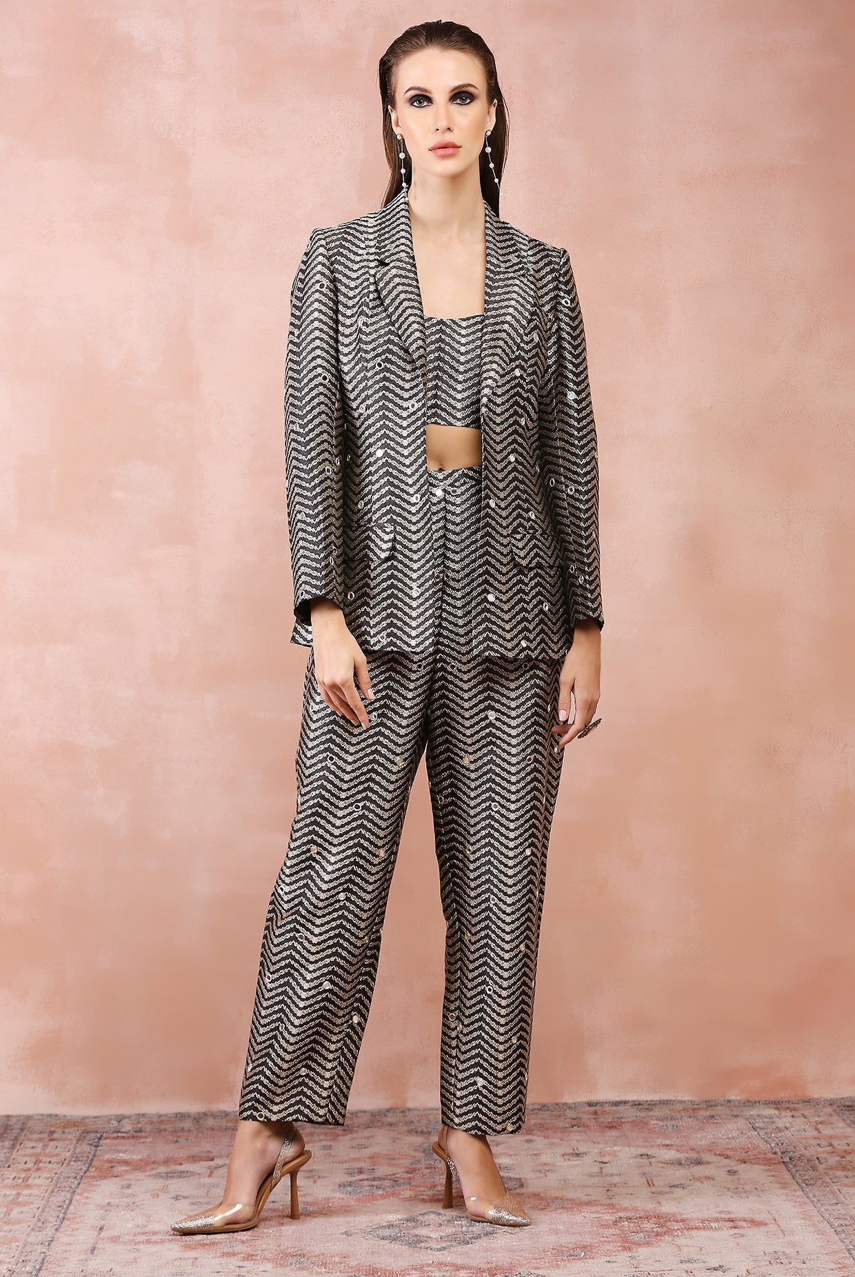 Black embroidered blazer with bustier and pant.